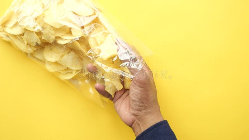 Potato Chips Spilling Form a Packet on Table Stock Video - Video of ...