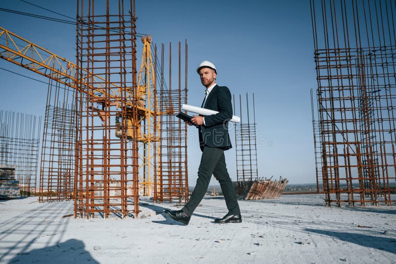 Holding Paper with Plan and Tablet. Businessman in Formal Clothes is on ...