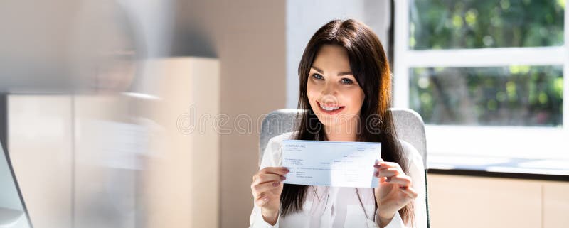 Holding Paycheck in Hand stock photo. Image of checkbook - 226479582