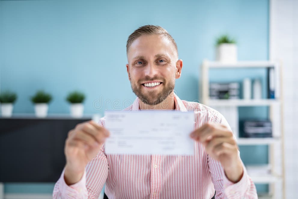 Holding Paycheck or Payroll Check or Insurance Cheque Stock Photo ...