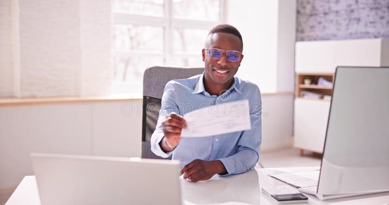 Holding Paycheck or Payroll Check or Insurance Cheque Stock Image ...