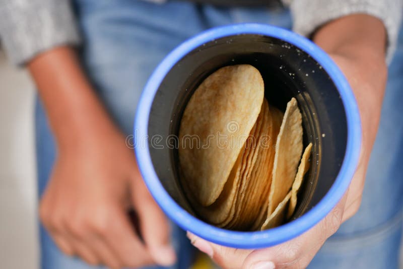 Holding a Plastic Container Full of Potato Chips Stock Image - Image of ...