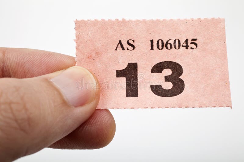 Holding a Raffle Ticket stock image. Image of holding - 26653799