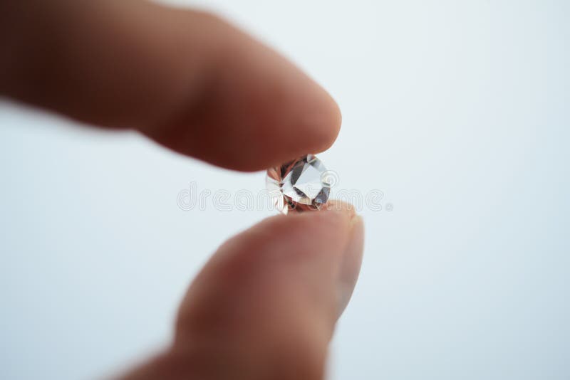 Holding a single diamond stock image. Image of examine - 27004289