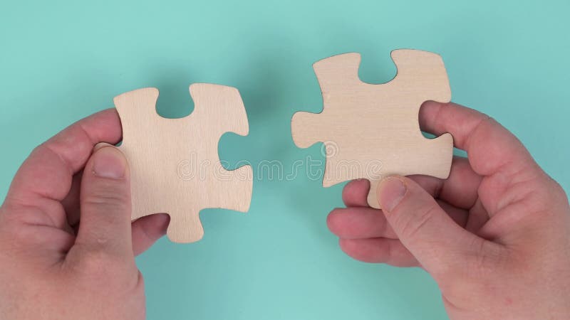 Two Pieces of the Puzzle Fit Together. Loop Animation of Two Puzzle ...