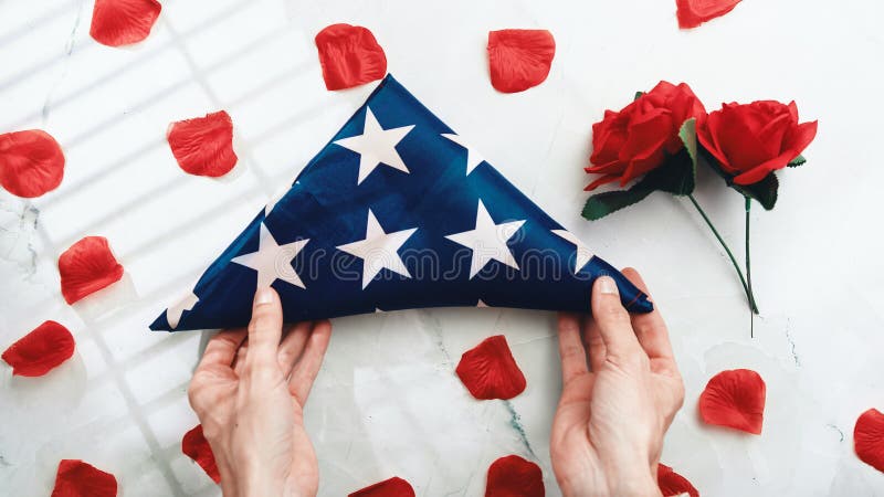 Holding USA Flag Folded into a Triangle Stock Image - Image of america ...