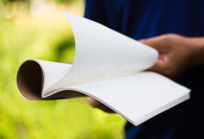 Holding white journal stock photo. Image of hardcover - 95769248