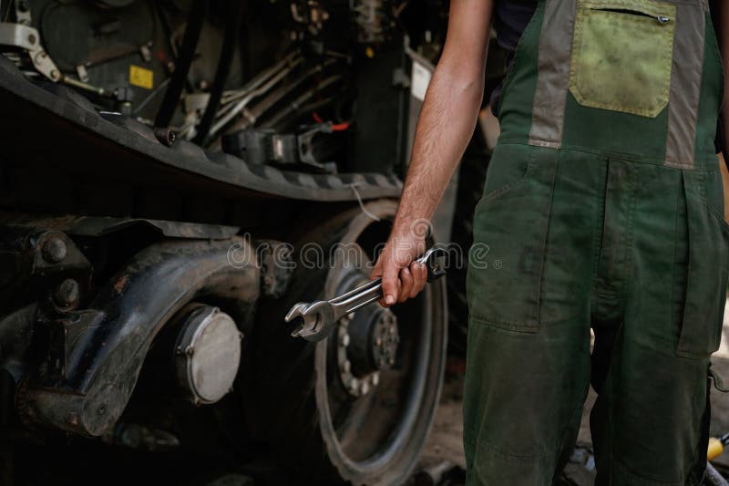 Holding Wrench. Mechanic S Hand Fixing Machinery in Workshop Stock ...
