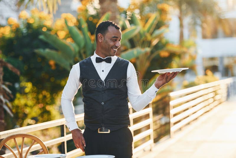 Holds Empty Plate. Black Waiter in Formal Clothes is at His Work ...