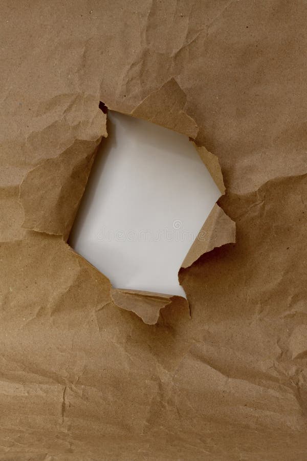 Vertical Shot Frame in the Form of a Torn Hole of Brown Paper with a ...