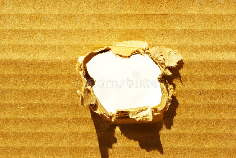 Hole in cardboard stock image. Image of power, material - 6171027