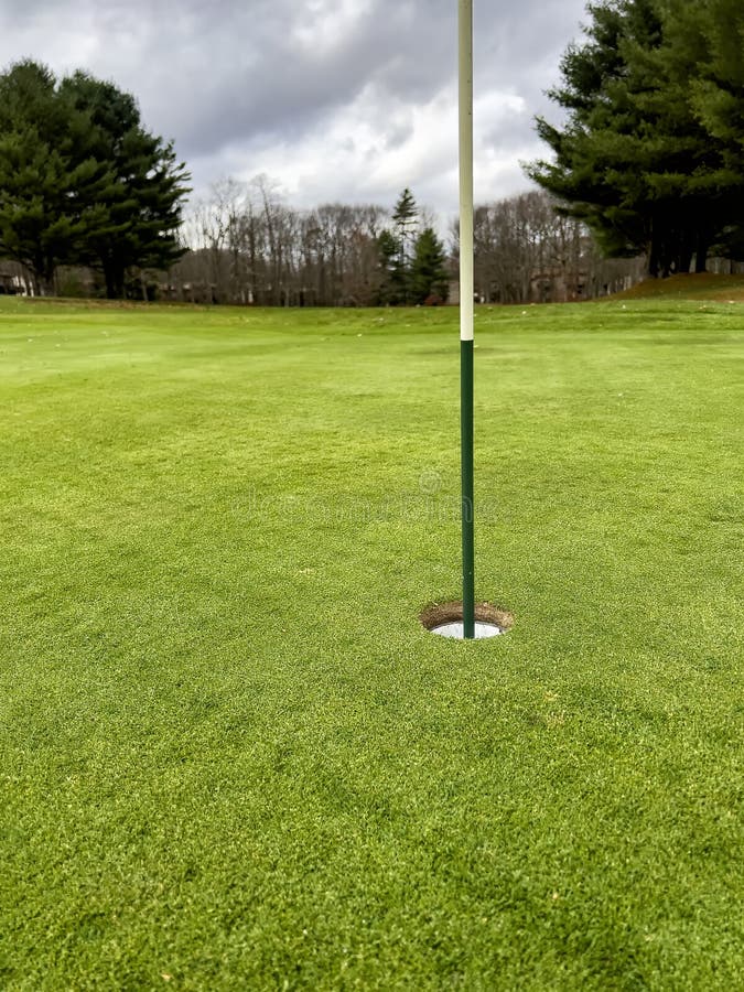 Hole on a Golf Course with a Pole Stock Photo - Image of people, hole ...
