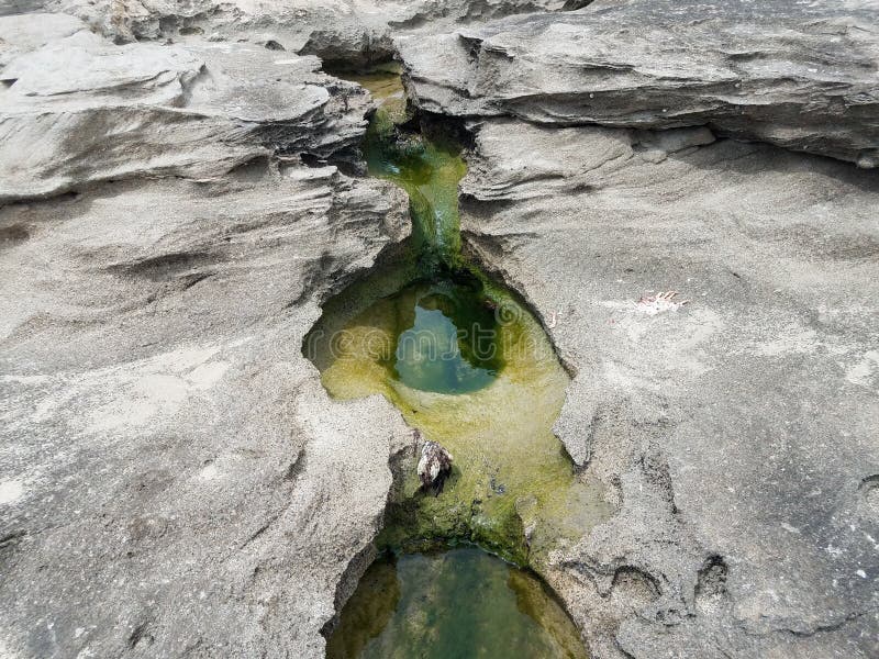 Hole in Grey Rock at Beach and Water in Puerto Rico Stock Photo - Image ...
