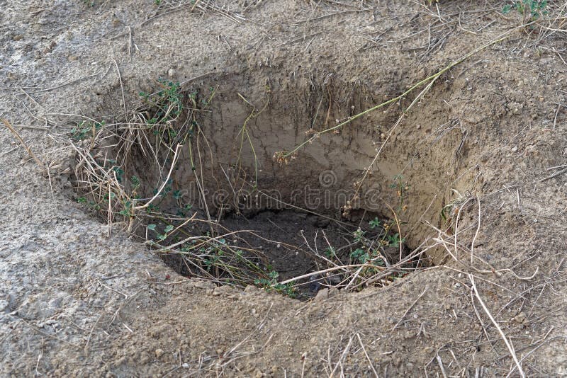 Hole in ground stock photo. Image of cavern, underground - 253737248