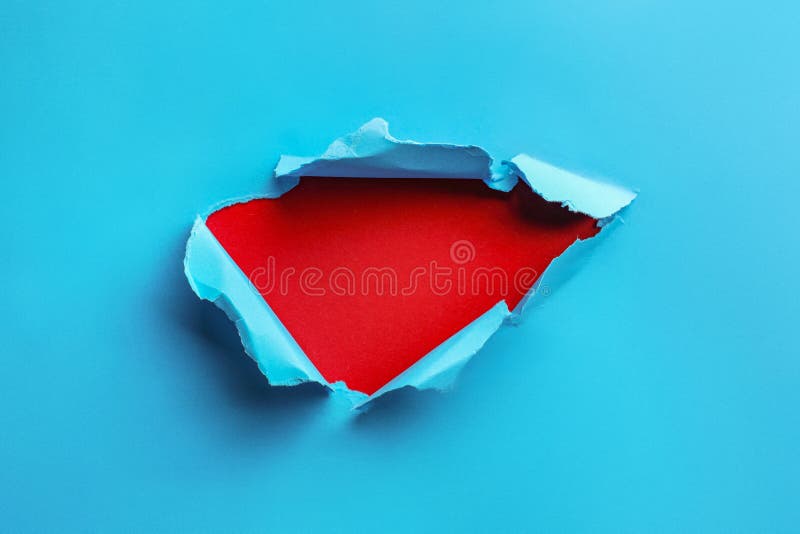 Hole in Light Blue Paper on Red Background Stock Photo - Image of ...