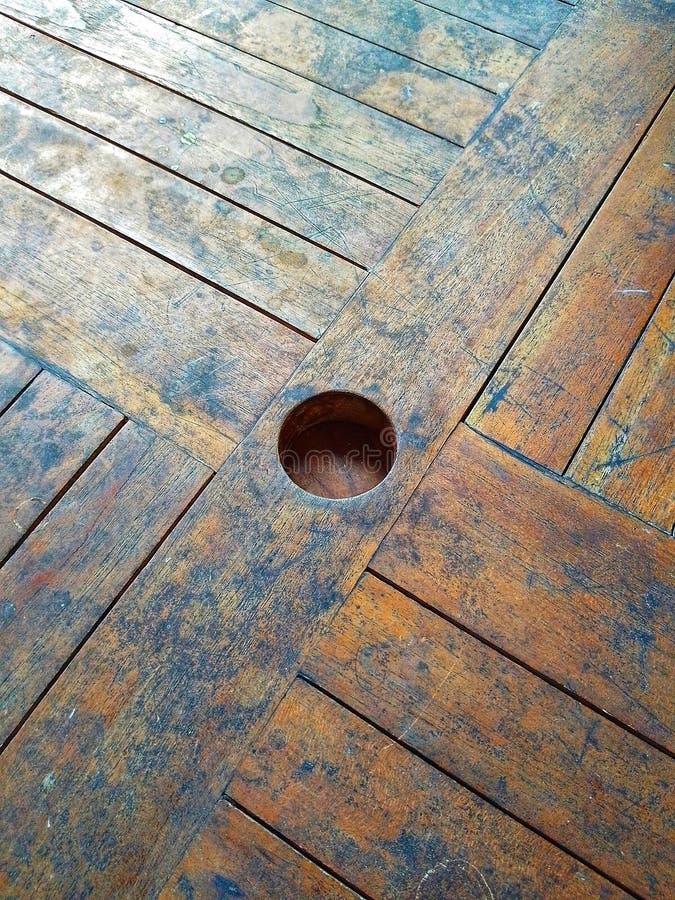 A hole in an old table. stock image. Image of cloth - 328774395
