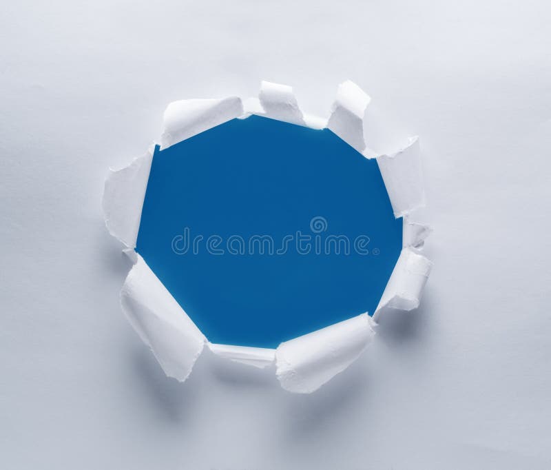 Hole on a Paper. Blue Background in the Hole Stock Image - Image of ...