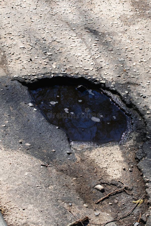 Hole in the Pavement on the Road Stock Image - Image of defect, puddle ...