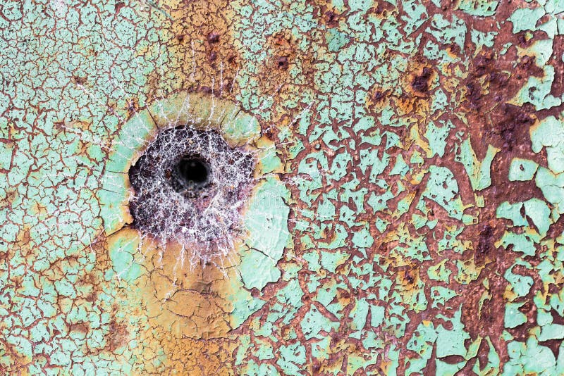 Hole in Rustic Metal Wall with Cobweb in it Stock Photo - Image of ...