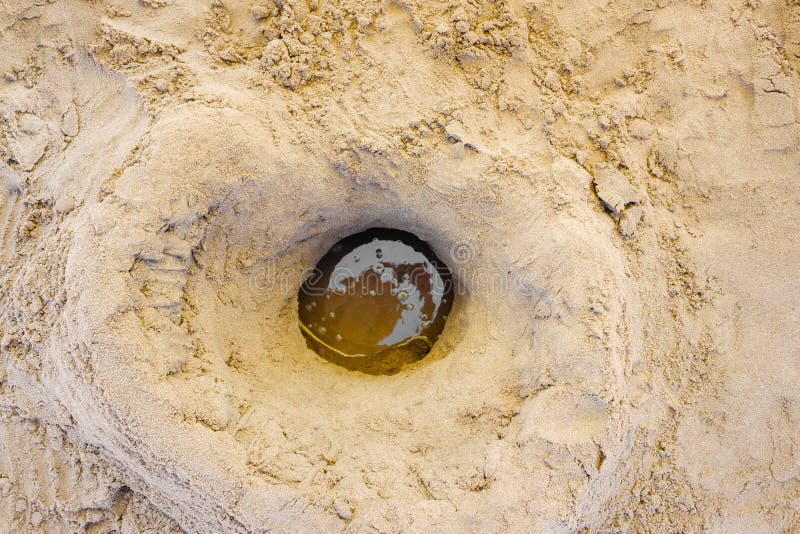 Hole in the Sand To Find Water in a Well Stock Photo - Image of ...
