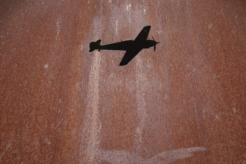 A Hole with the Shape of an Airplane in Rusting Metal Stock Image ...