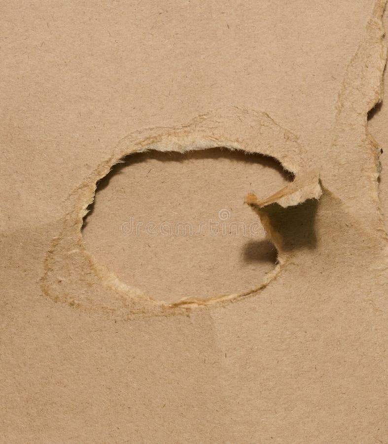Hole with Torn Edges in Brown Cardboard Stock Image - Image of page ...