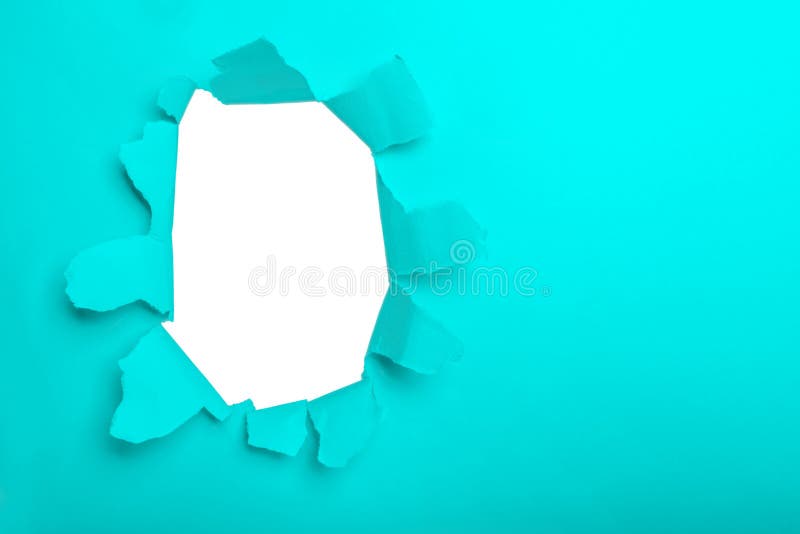 A hole in turquoise paper stock photo. Image of cracked - 268705230