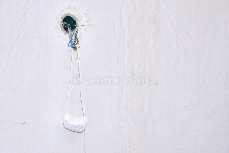 A Hole in Wall for an Electrical Socket Switch with Wires, Protective ...
