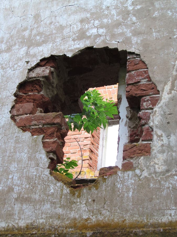 Hole in the Wall of an Old Abandoned Building Stock Photo - Image of ...