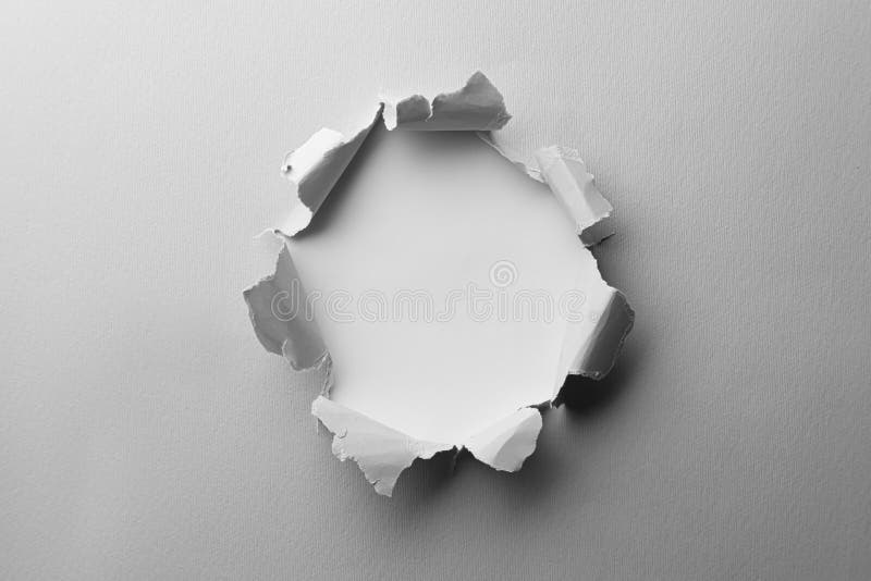 Hole in White Paper on Light Background Stock Photo - Image of industry ...