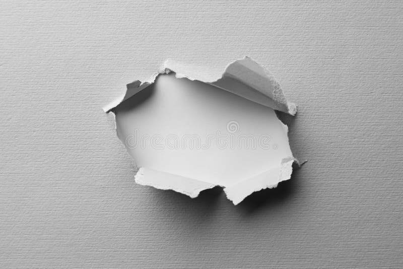 Hole in White Paper on Light Background Stock Image - Image of round ...