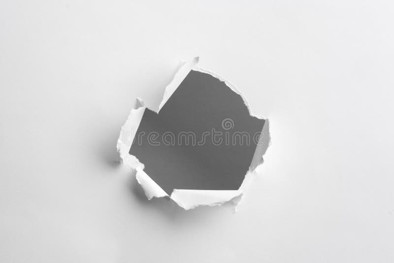 Hole in White Paper on Light Background Stock Image - Image of ...