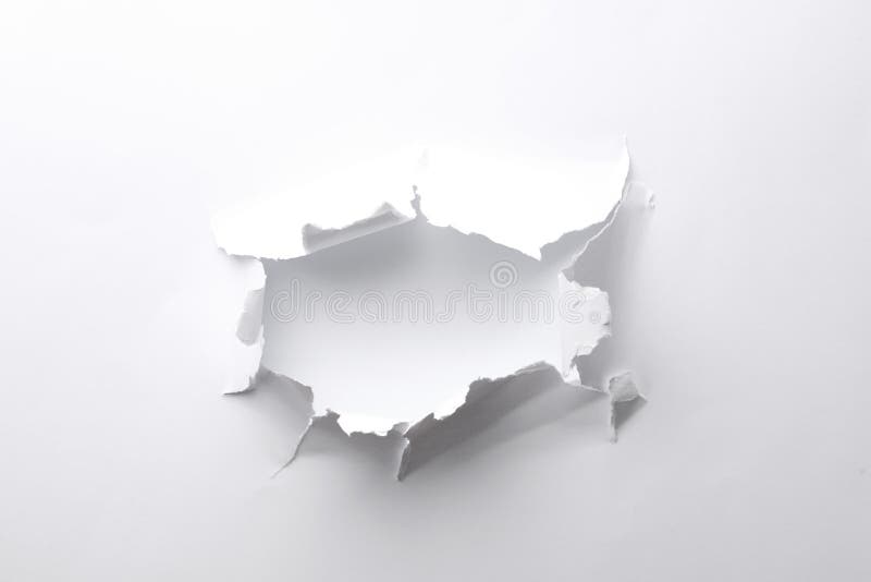 Hole in White Paper on Light Background Stock Photo - Image of ...