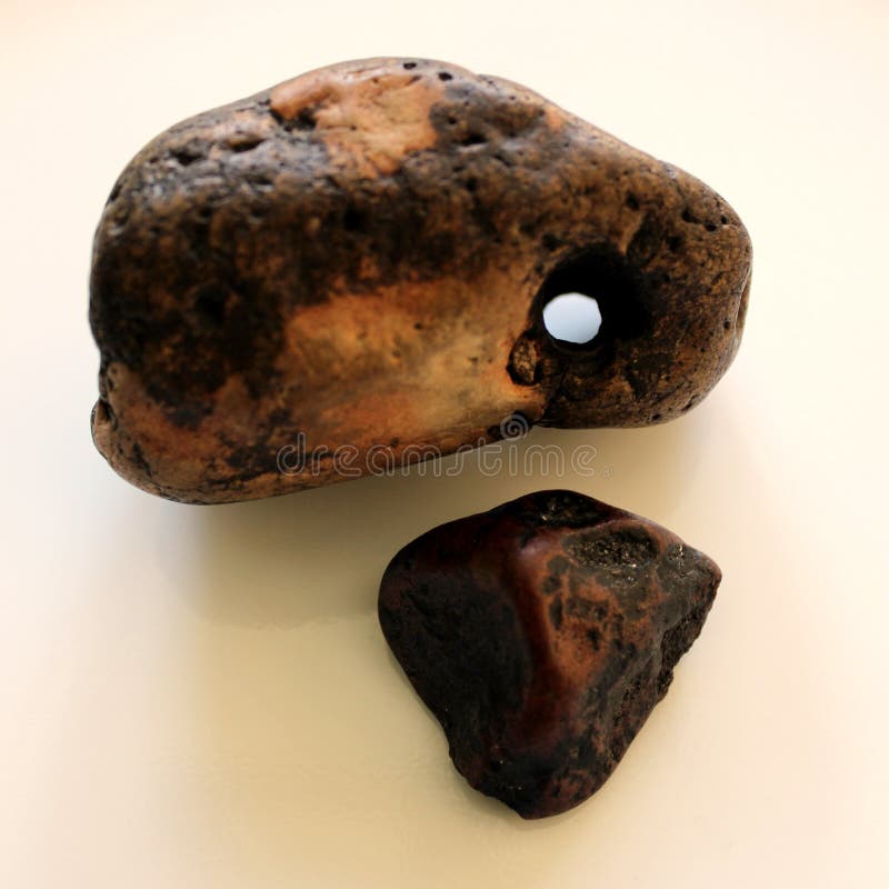 Holed Stone and Jasper Pebble Stock Image - Image of holed, rough ...