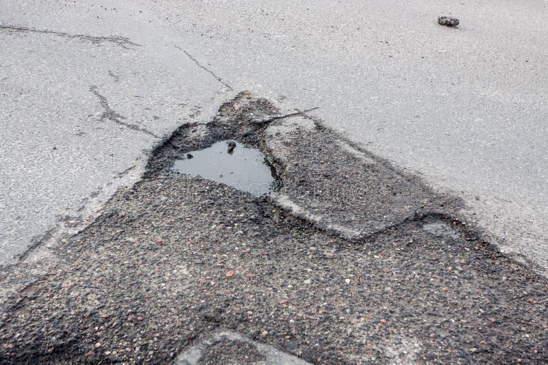 Pot holes in road stock image. Image of damage, danger - 60728755
