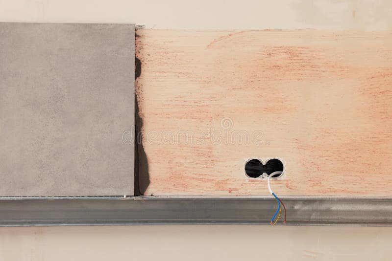 Holes for Sockets with Cables on Wall. Tiles Installation Process Stock ...
