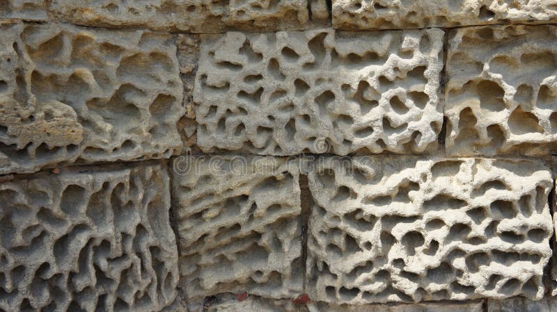 Holes on a stone wall stock image. Image of textured - 169180799