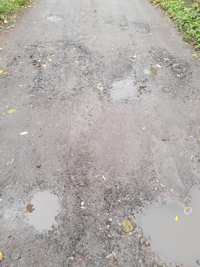 Holey non-asphalt road stock image. Image of sand, rock - 296578775