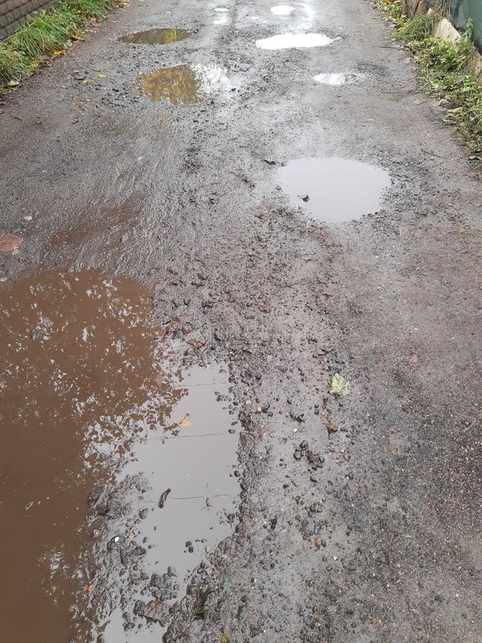 Holey non-asphalt road stock photo. Image of freezing - 296578830