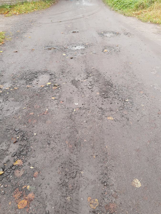 Holey non-asphalt road stock image. Image of track, cobblestone - 296578957