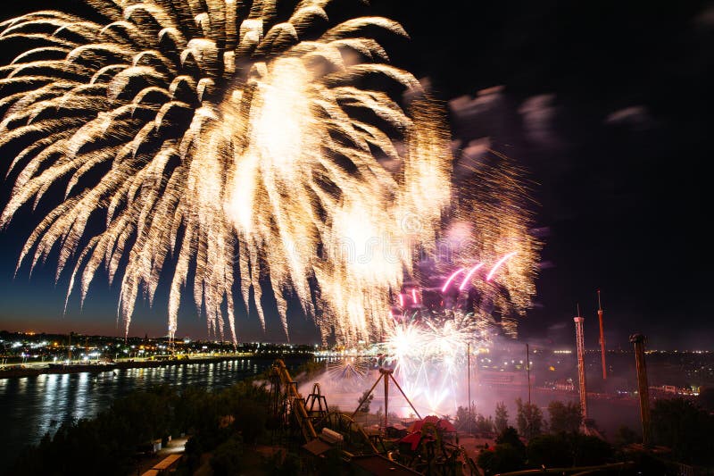 Holiday Fireworks Above Water with Reflection on the Black Sky ...