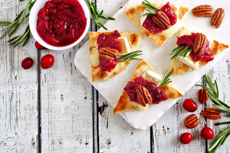 Holiday Flatbread Appetizers with Cranberries and Brie, Top View on ...
