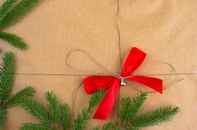 Holiday Gift Wrapping with a Red Bow and Rope Stock Photo - Image of ...