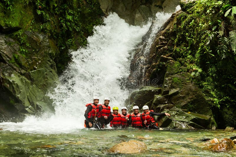 Group of Adult People Jumping into Small Waterfall Stock Photo - Image ...