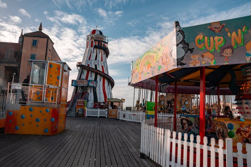 Holiday Makers on Roller Coasters and Rides at the Amusement Park on ...
