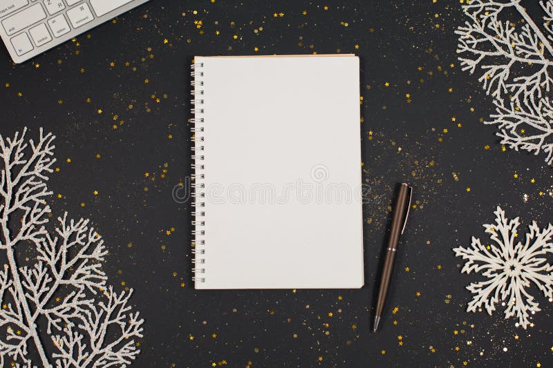 Holiday White Decorations and Notebook on Black Background Stock Image ...