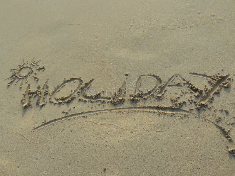 Holiday Word Written in Sand Stock Image - Image of impression, sandy ...
