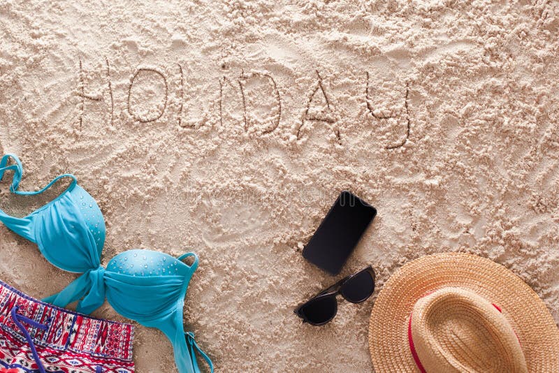 Holiday Written in a Sandy Tropical Beach Stock Photo - Image of straw ...