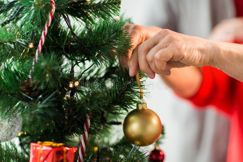 Close Up of Senior Woman Decorating Christmas Tree Stock Image - Image ... Close Up of Senior Woman Decorating Christmas Tree Stock Image - Image ...