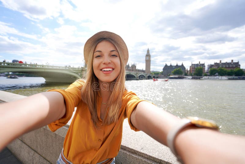 Holidays in UK. Brazilian Girl Takes Selfie Picture with Smartphone in ... Holidays in UK. Brazilian Girl Takes Selfie Picture with Smartphone in ...